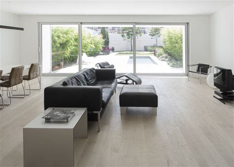 Hinged Shutters Camouflage With Facade Of Townhouse By Humberto Conde