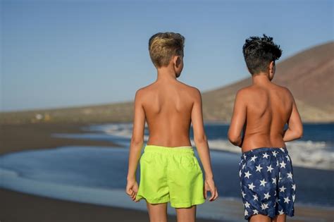 Premium Photo Brothers Enjoying At Beach