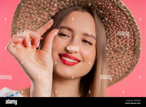 Young Woman Showing Small Invisible Abstract Subject Tiny Object Sizes