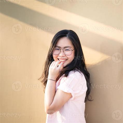 Young Glasses Asian Chinese Thai Girl Is Smiling And Happy On Rooftop