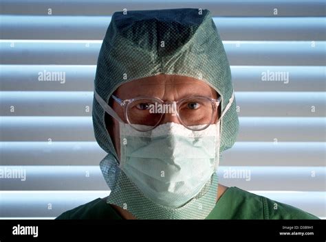 Dpa The Undated Symbolic Picture Shows A Surgeon Wearing A Mask And Working Clothes Stock