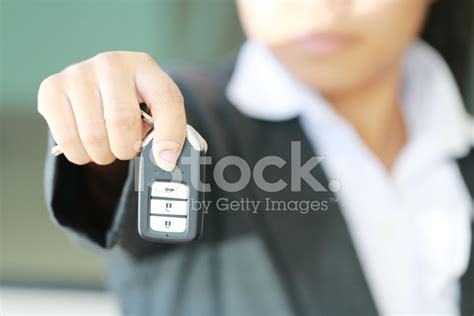 Business Woman Show A Remote Key Stock Photo Royalty Free FreeImages