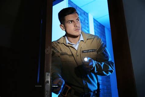 Professional Security Guard With Flashlight Checking Room Stock Image Image Of Control Patrol