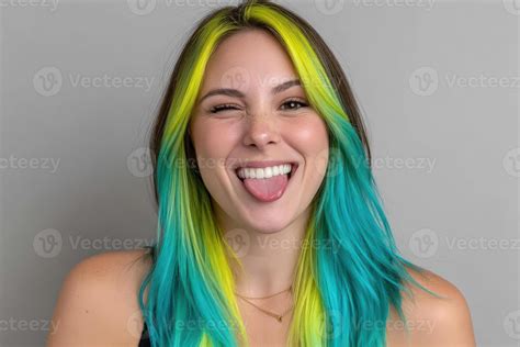 Playful Woman With Vibrant Hair Sticking Tongue Out 65366405 Stock