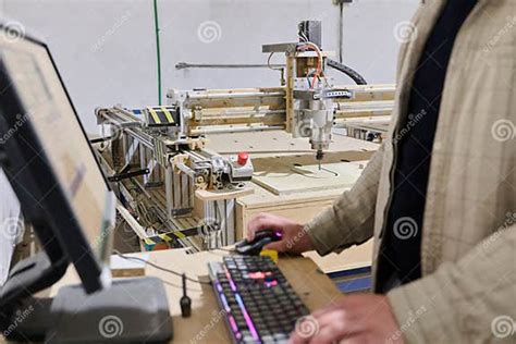 Operator Entering Coordinates On Computer For Cnc Machine To Precisely