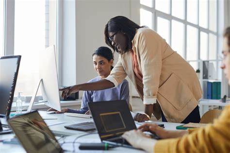 Premium Photo Side View Portrait Of Female Team Leader Instructing