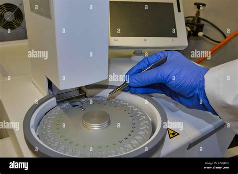 Scientist Analysing A Sample By DSC In A Chemistry Laboratory Differential Scanning Calorimetry