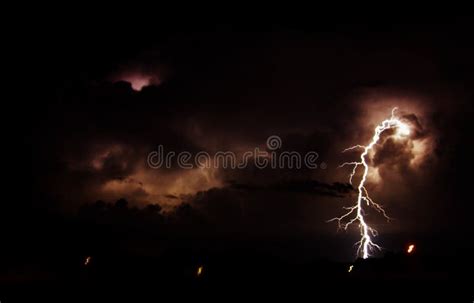 Beautiful Shot Of A Lightning Strike In The Cloudy Night Sky Stock Image Image Of Light Bolt