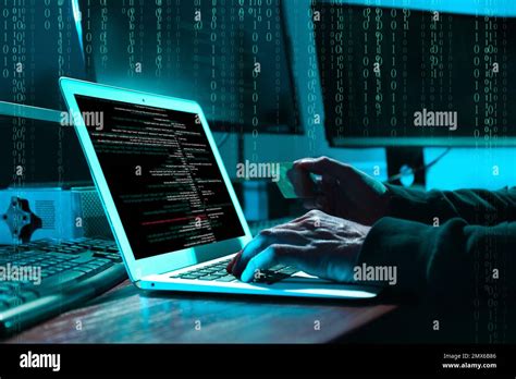 Cyber Criminal With Credit Card Hacking System At Table Digital Binary Code On Background Stock