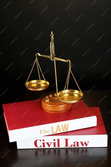 Premium Photo Books Of Law On Table On Dark Background