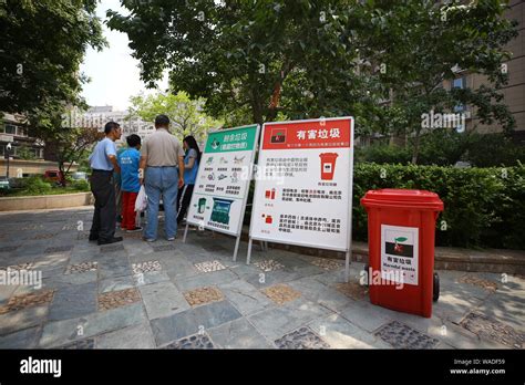 Volunteers In The Community In Beijing Teach The Old How To Classify