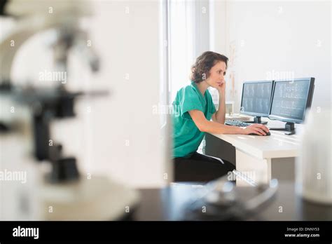 Female Technician Working On Computer Stock Photo Alamy