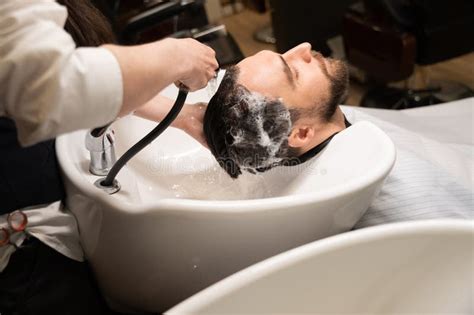 Barber Woman In A Salon Washes A Mans Hair Stock Image Image Of Haircut Stylish 285473359