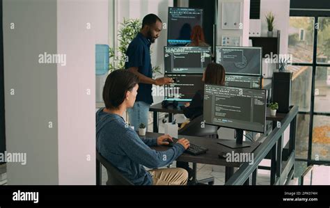 Database Programer Writing Code On Computer In Software Company Office Displaying Artificial