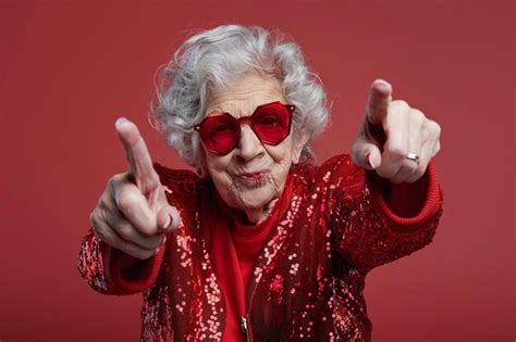 An Old Lady Wearing Red Sunglasses And A Red Background Premium Ai Generated Image