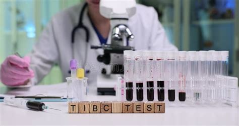 Comprehensive Process Of Conducting A Laboratory Tibc Test Using Test Tubes And Microscope Stock