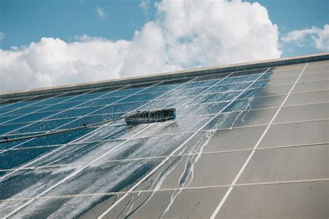 Close Up Shot Of Solar System Panel Cleaning Process Stock Image