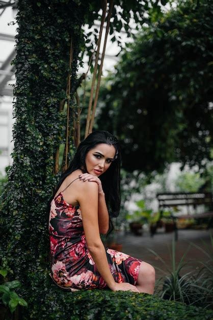 Premium Photo A Young Beautiful Brunette Posing Among Dense Thickets