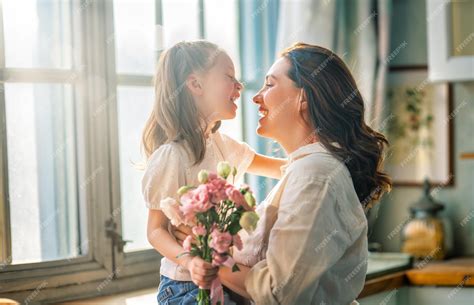 Premium Photo Daughter Giving Mother Bouquet Of Flowers
