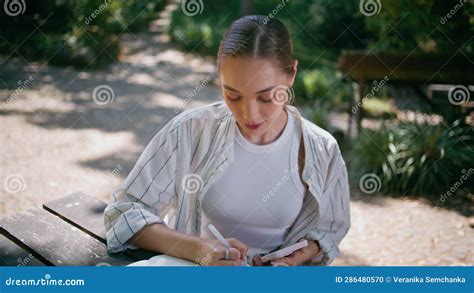 Relaxed Girl Scrolling Smartphone Searching Information At Park Table Close Up Stock Footage