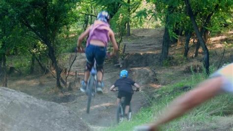 Three Cyclists Pass By The Camera Stock Footage Videohive