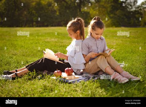 Two Teenage Girls Prepare Together For Passing Tests And Exams Sitting