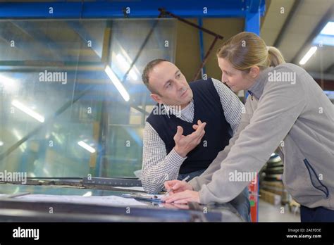Man And A Woman Checking Inventory Levels Of Goods Stock Photo Alamy