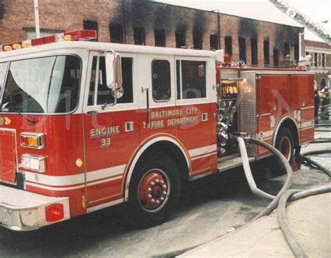 Red Fire Truck Parked In Front Of Brick Building Red Fire Truck