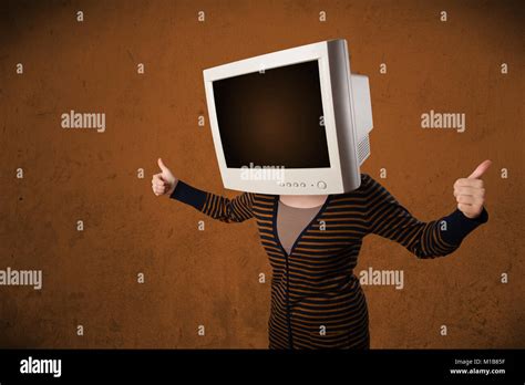 Girl With A Computer Monitor On Her Head And Empty Brown Copyspace Stock Photo Alamy