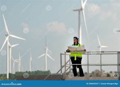 Portrait Of Female Engineer At Natural Energy Wind Turbine Site With The Mission Of Being