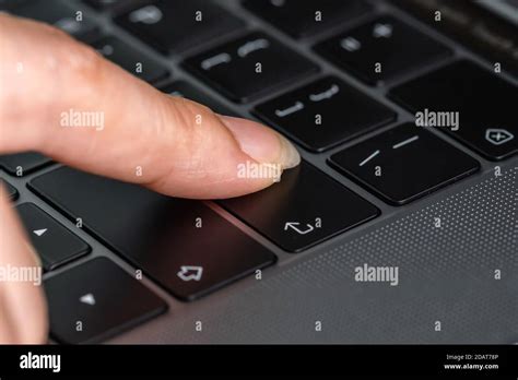 Close Up Female Hand Pressing Enter Button On A Laptop Keyboard Stock Photo Alamy