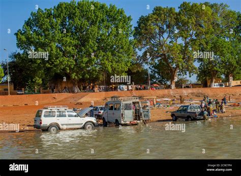 Cars Being Washed Along The River Bank Of The Bani River In Mopti In