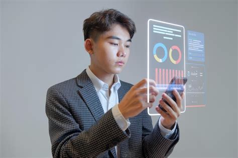 Young Asian Businessman Analyzing Data Digital Tablet Graphs Modern Data Analytics Business