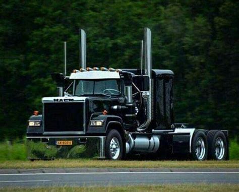 Custom Trucks Black Semi Truck Driving Down Road Black Mack Truck