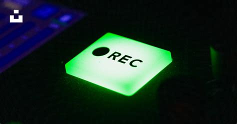 A Keyboard With A Glowing Green Rec Button On It Photo Free