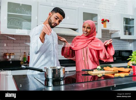 Happy Middle Eastern Couple Wearing Traditional Arab Clothing At Home Married Arabian Husband